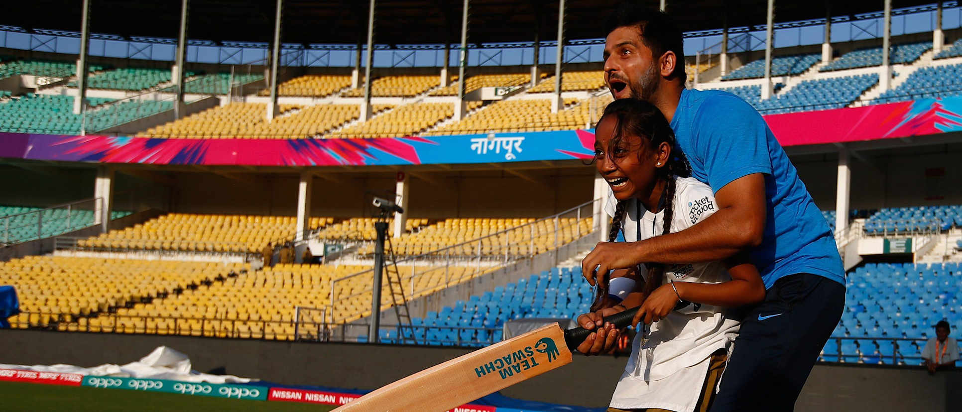 Children starry eyed as Suresh Raina bats with them